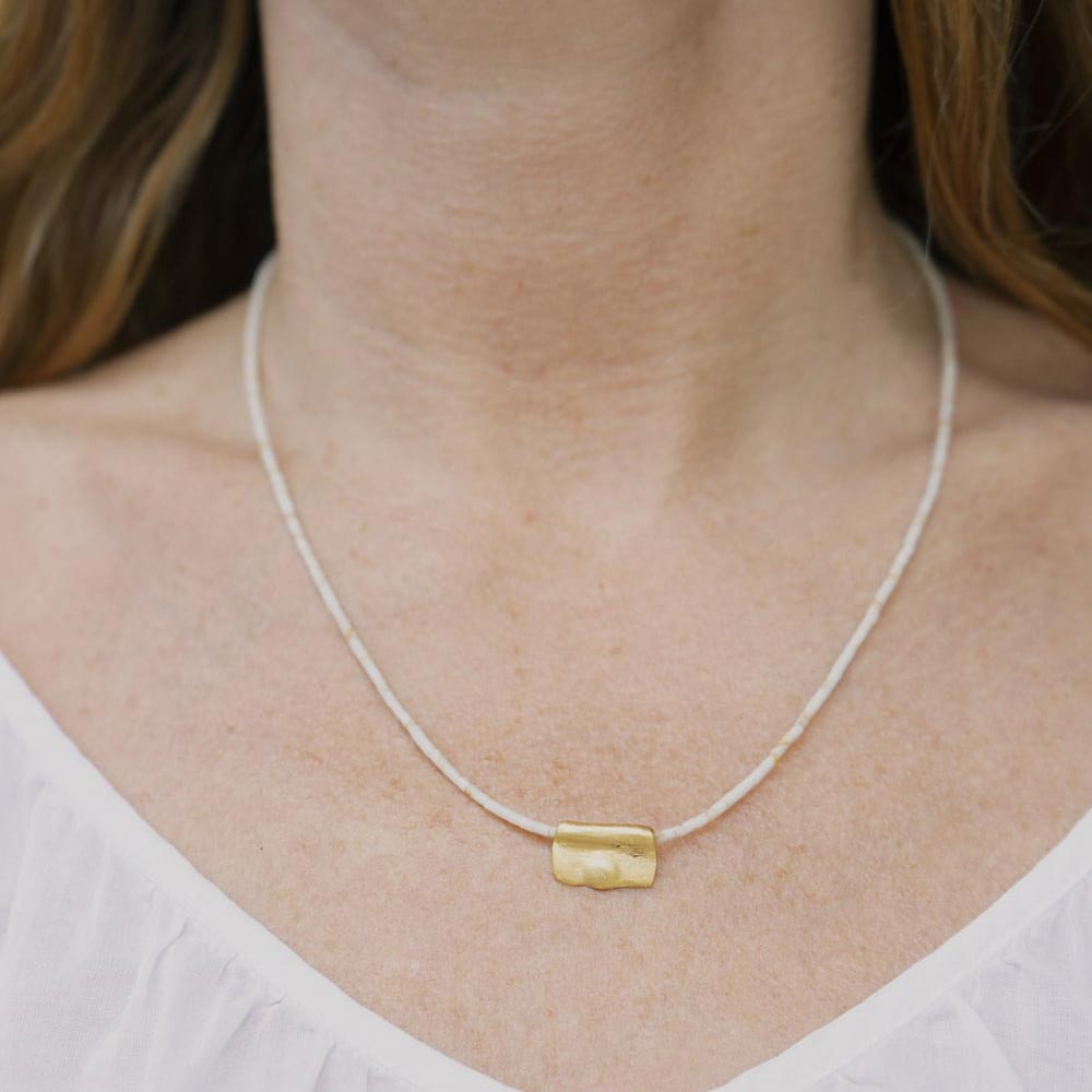 Token Necklace by TAKARA – Press & Still